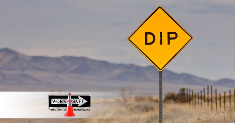 What Does a ‘Dip’ Road Sign Mean? - Worksafe Traffic Control